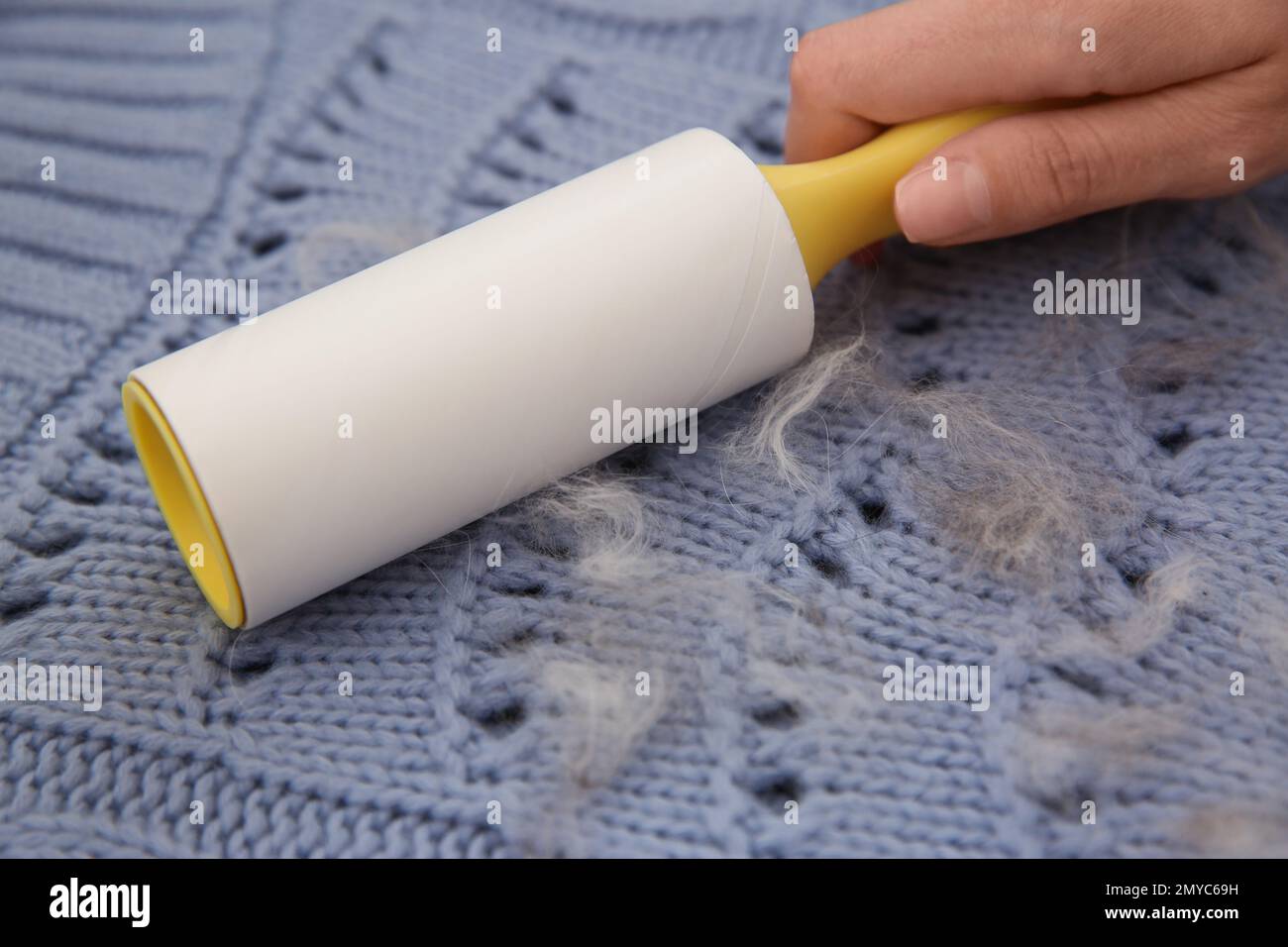 Woman removing her sweater hi-res stock photography and images - Alamy