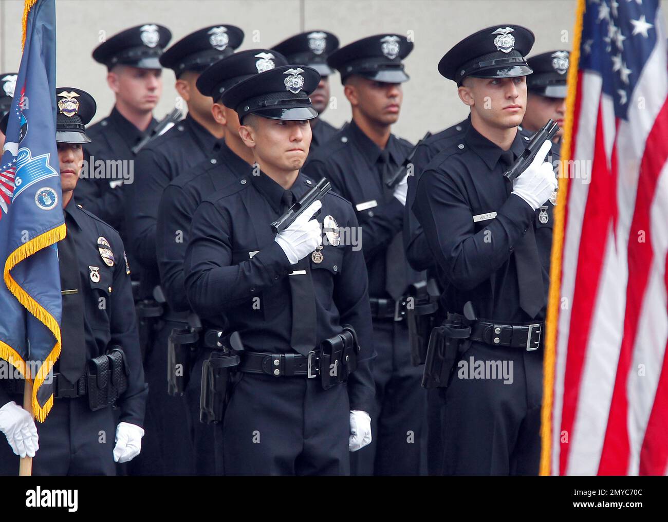 Members of the graduating class of Los Angeles police officers wear ...
