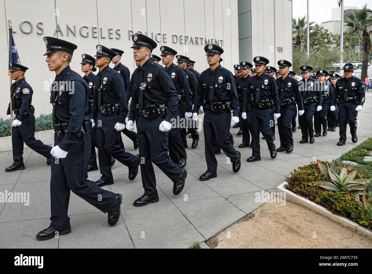 Members of the graduating class of Los Angeles police officers wear ...