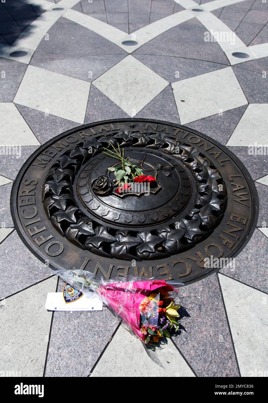 Five red roses and a bouquet of flowers with a note of support for the ...