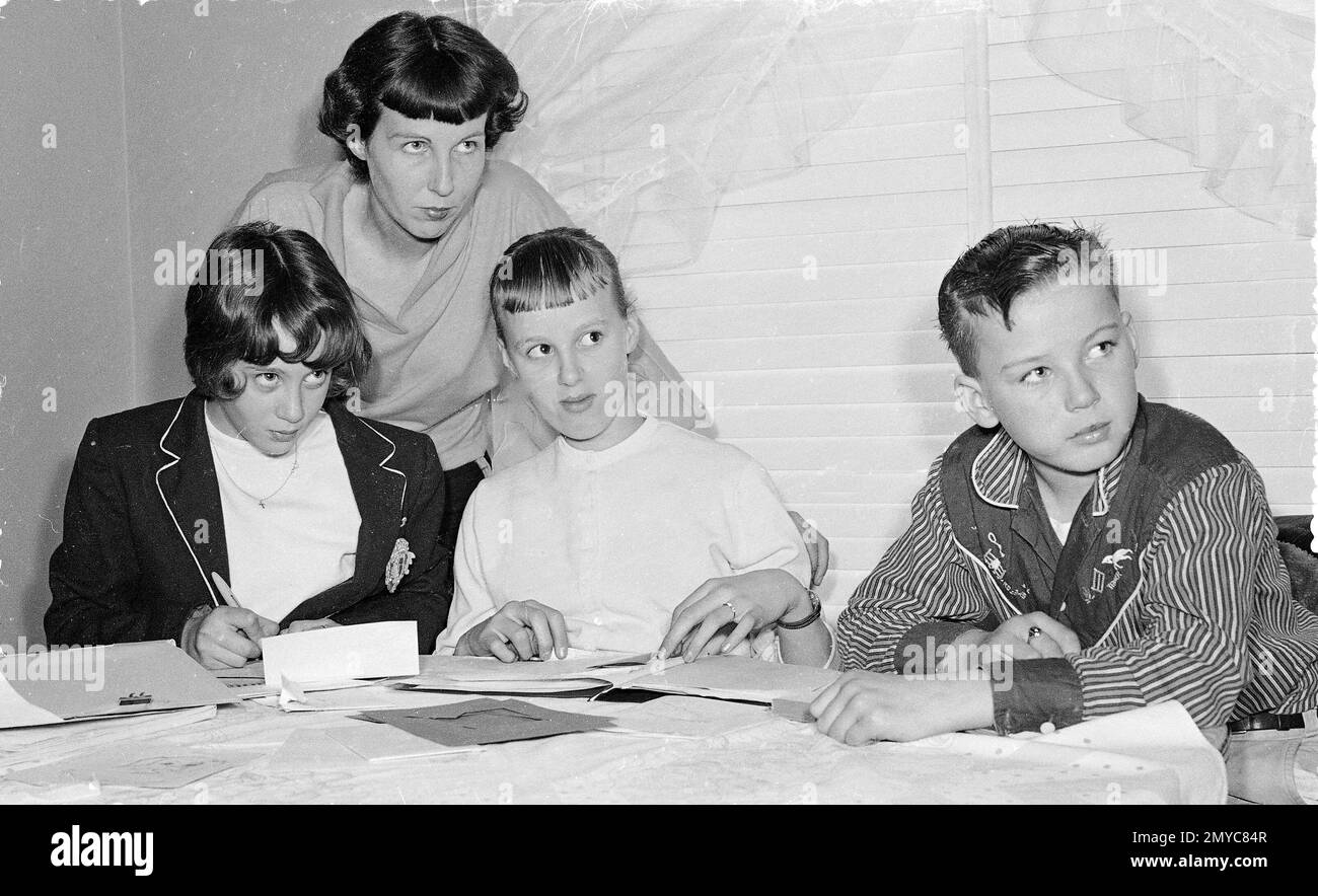 Barbara Orr helps her children - Patricia, Susan and Gary - with their ...