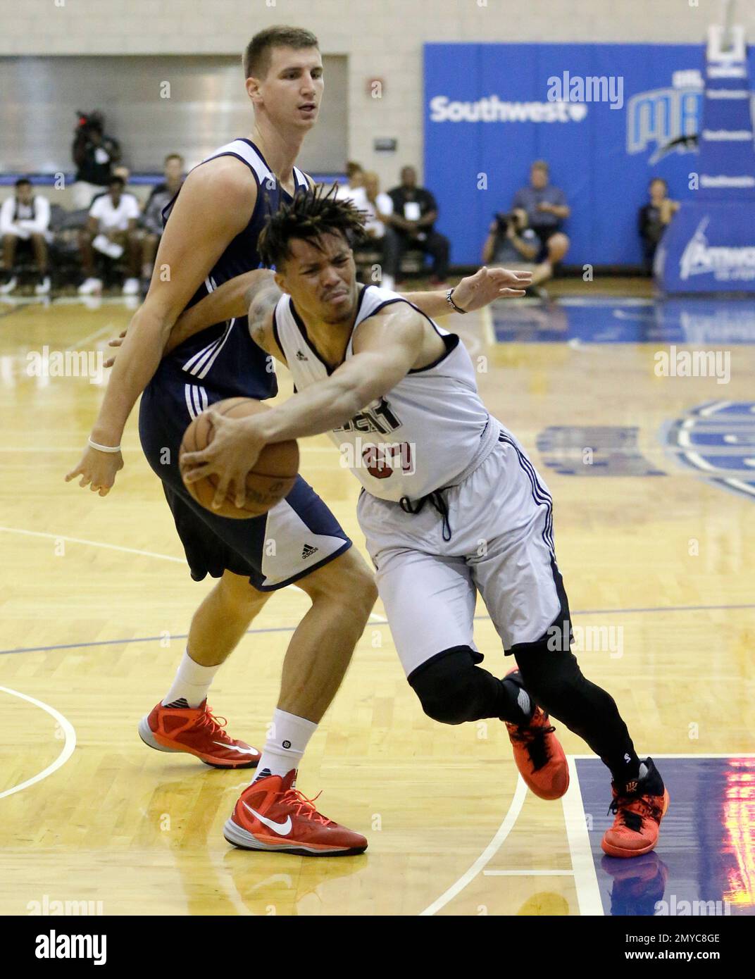 Miami Heat's Damion Lee (67) draws a foul as he gets tangled up with ...