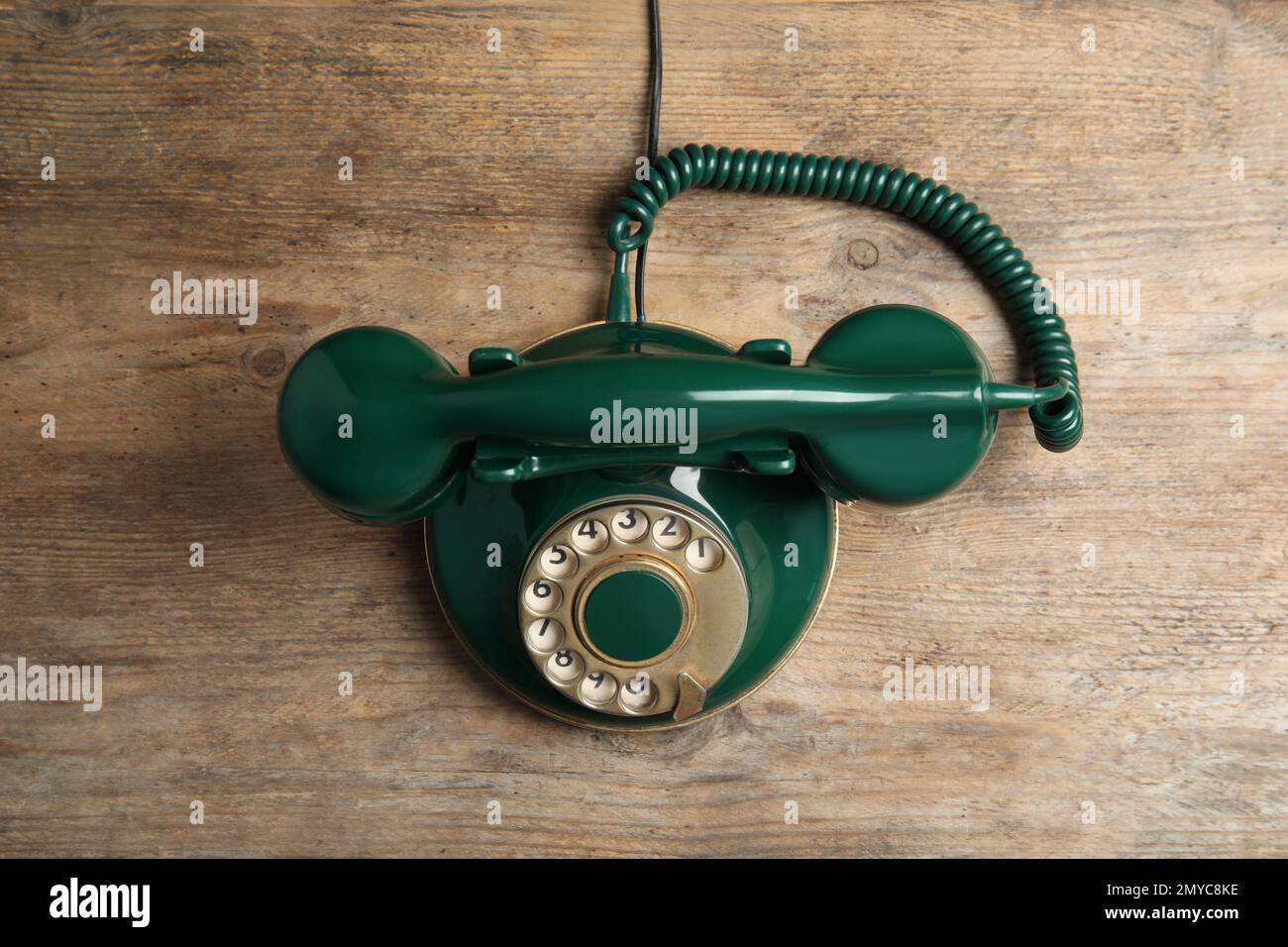 Vintage corded phone on wooden table, top view Stock Photo - Alamy