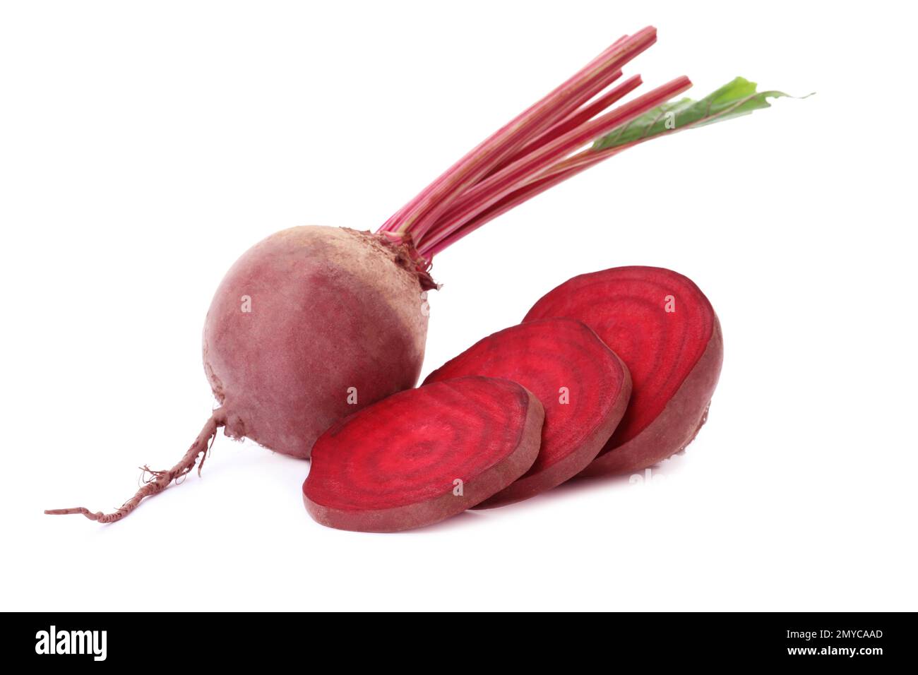 Whole and cut red beets on white background Stock Photo - Alamy