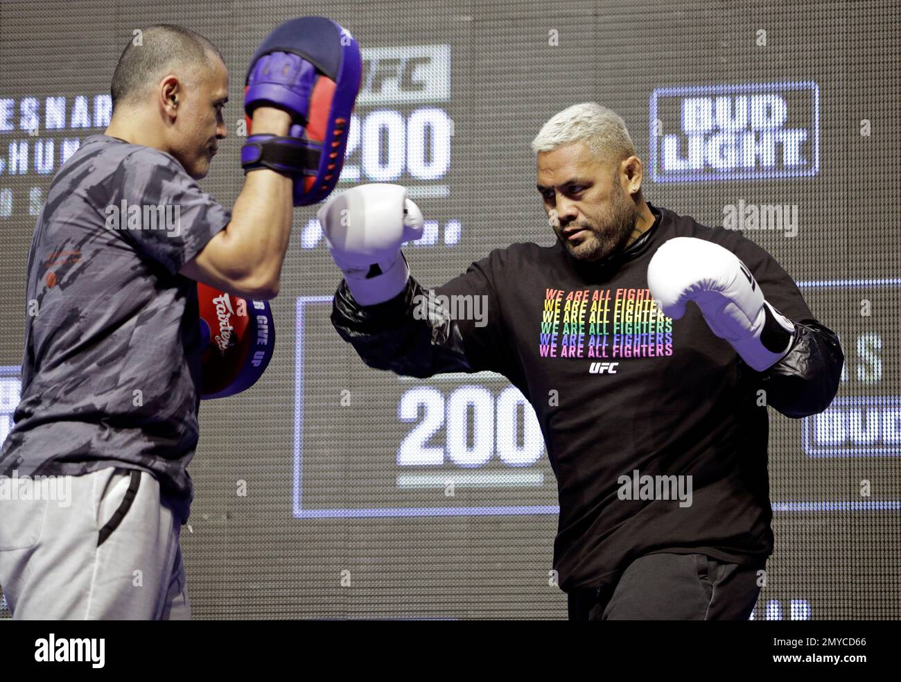 Mark Hunt, right, works out during a UFC 200 mixed martial arts workout ...