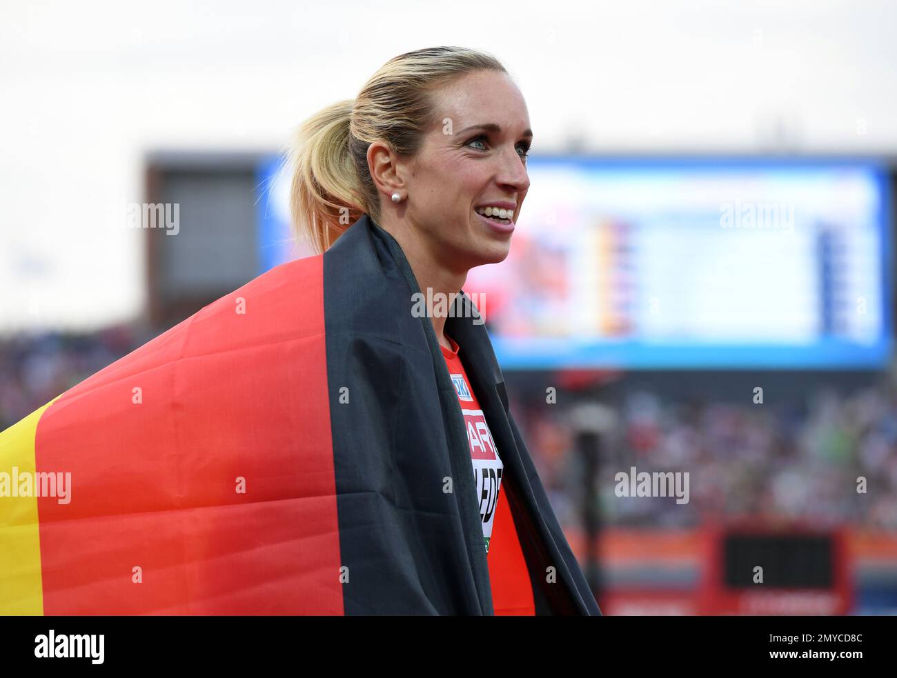 Germany's Cindy Roleder smiles after winning the women’s 100m hurdles ...