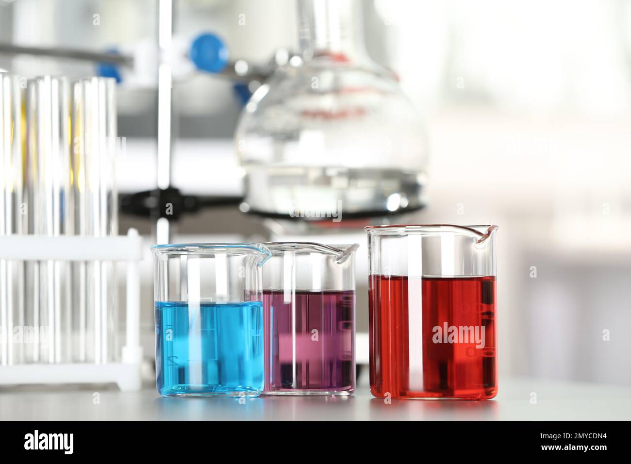 Glass beakers with liquid samples on table. Laboratory analysis Stock ...