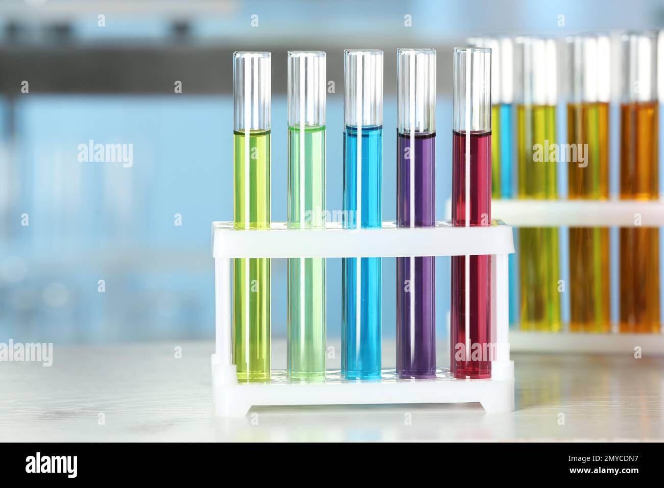 Test tubes with liquid samples on table. Laboratory analysis Stock ...