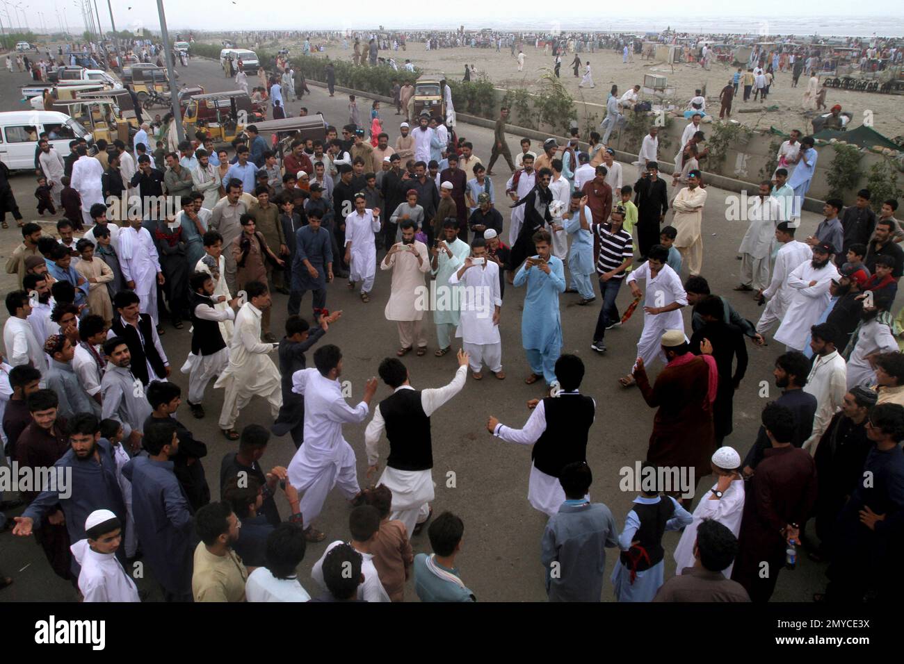 Pakistani Pashtun youth perform their traditional dance while they ...