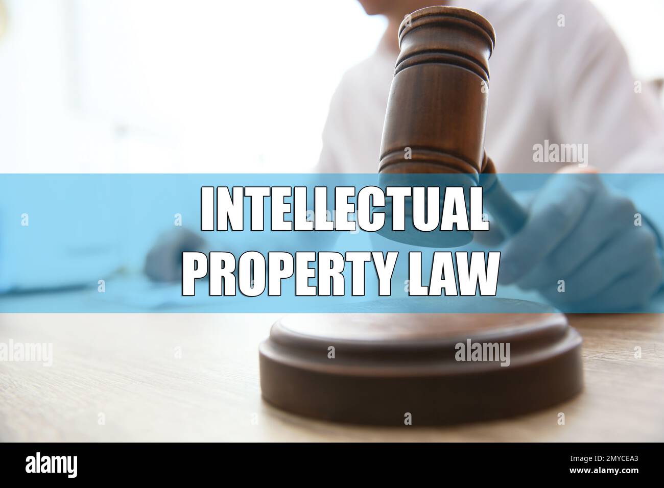 Intellectual property law. Judge with gavel at table, closeup Stock ...