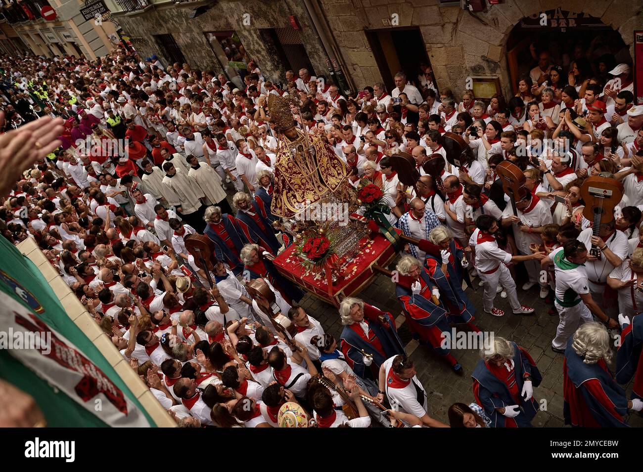 People carry a statue of San Fermin Saint while take part in a ...