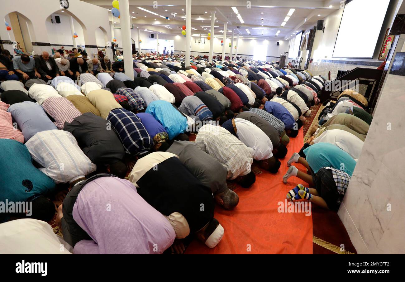 Men kneel during a prayer service at the Muslim Association of Puget ...