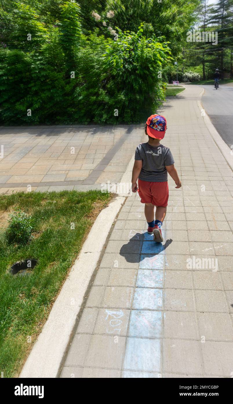 Toronto, Canada, June 2021 - Back view of little boy wearing a cap ...
