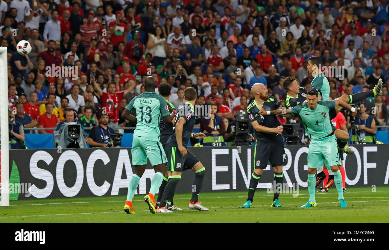 Portugal's Cristiano Ronaldo, top right, scores the opening goal during ...
