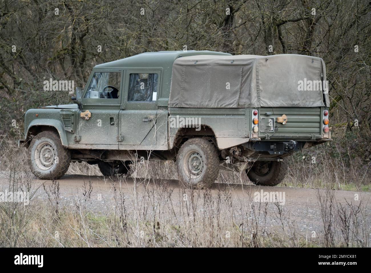 British army land rover defender wolf driving along a dirt track Stock ...