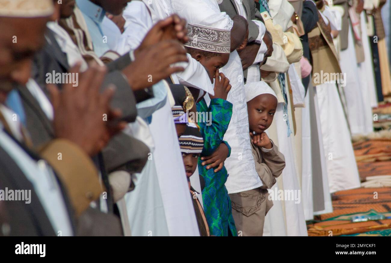 Kenyan Muslim boys join in prayers during the Eid al-Fitr on the open ...