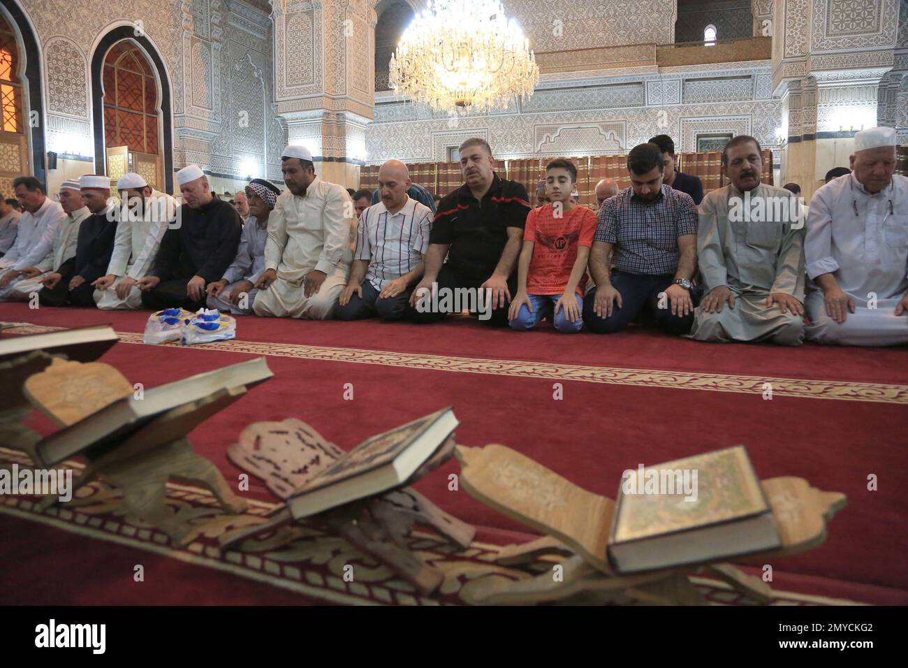 Iraqi Sunni Muslims pray on the first day of Eid al-Fitr prayers in ...