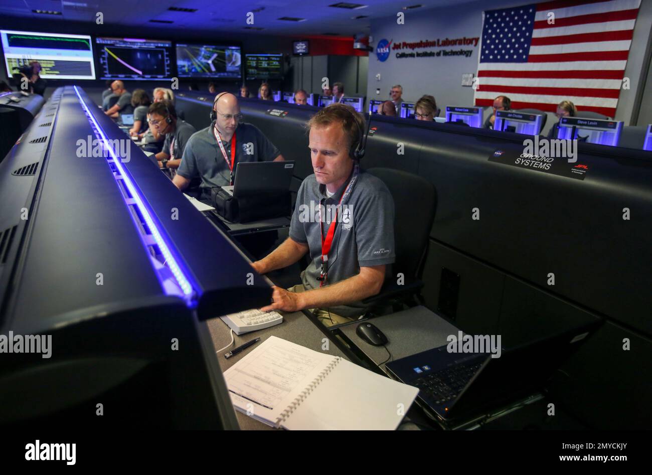 Staff members of Juno Mission watch on before the solar-powered Juno ...
