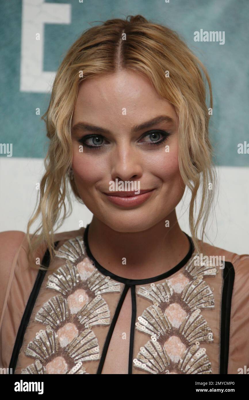 Actress Margot Robbie poses for photographers upon arrival at the ...
