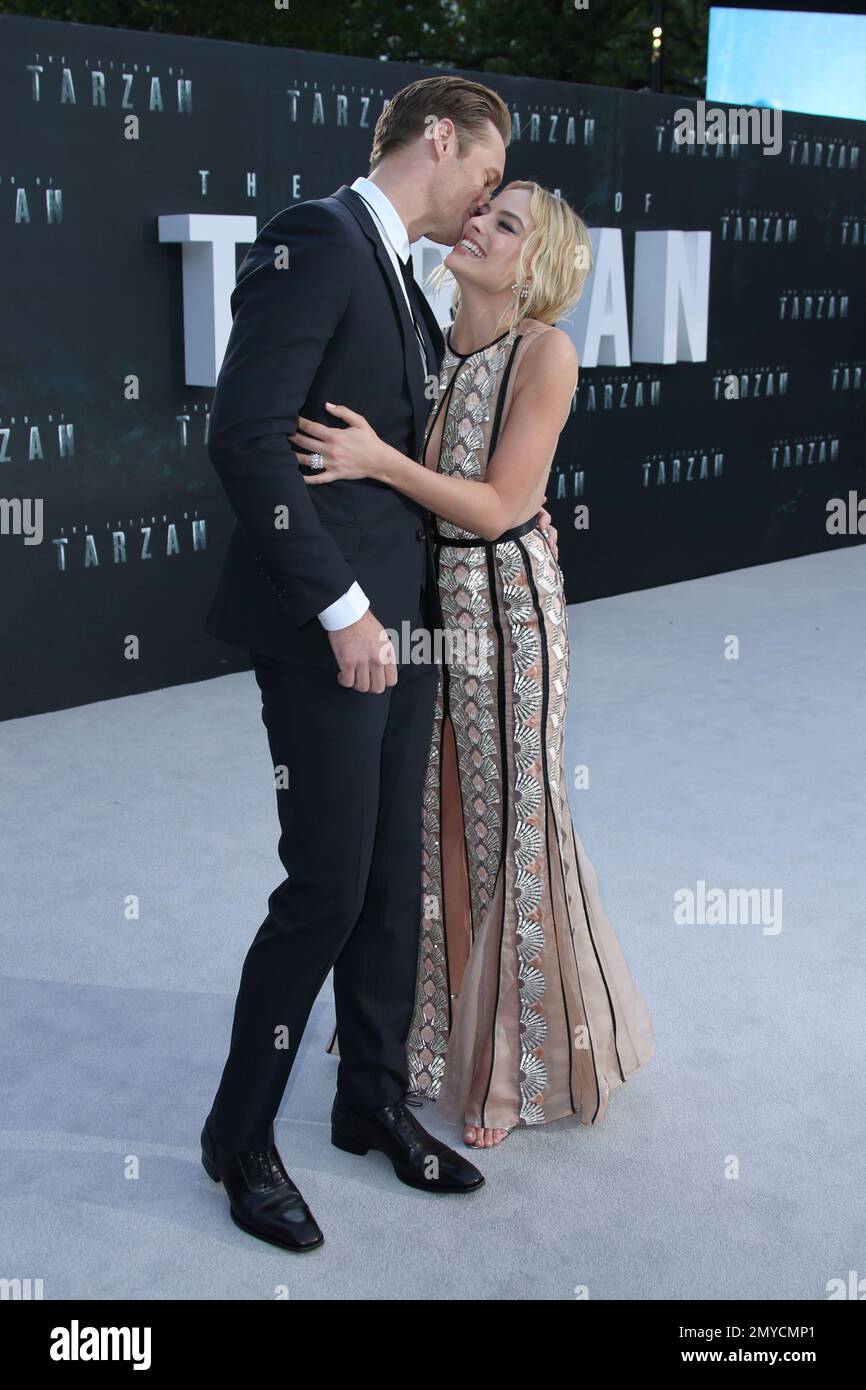 Actors Margot Robbie and Alexander Skarsgard pose for photographers ...