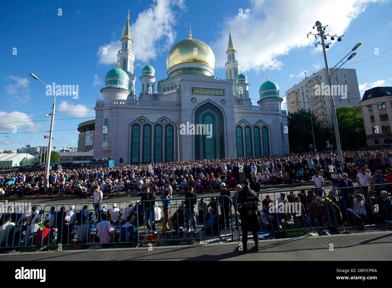 Muslim men gather to perform Eid al-Fitr prayers outside Cathedral ...