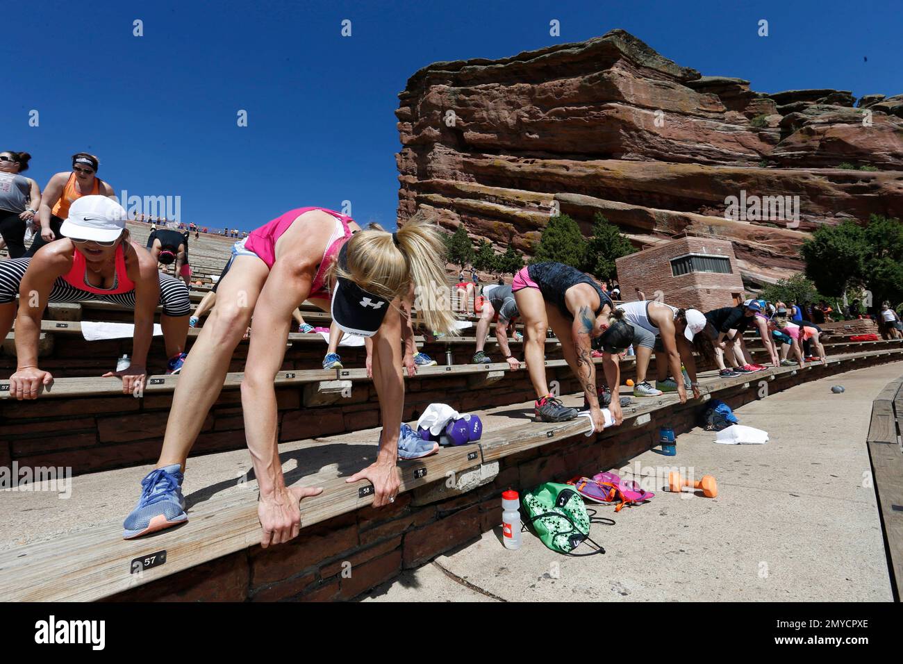 In this May 29, 2016 photo, workout enthusiasts carry out their routine ...