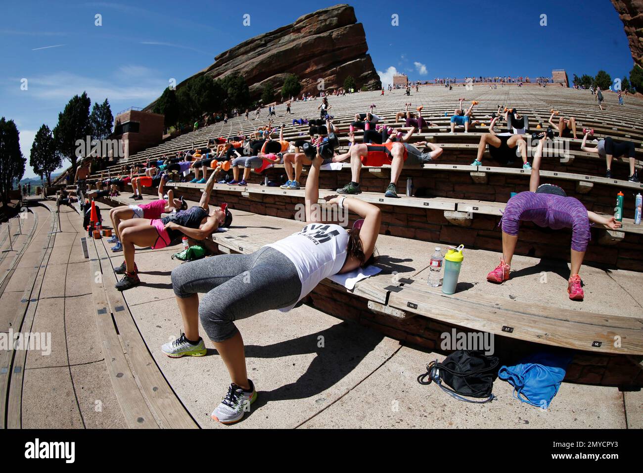 In this May 29, 2016 photo, workout enthusiasts carry out their ...