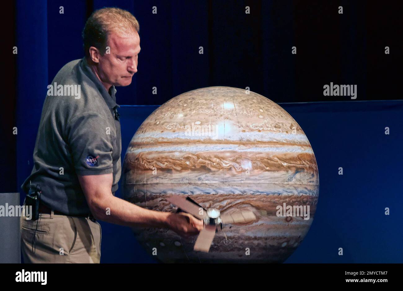 Rick Nybakken, Juno Project Manager, holds a model of the Juno ...