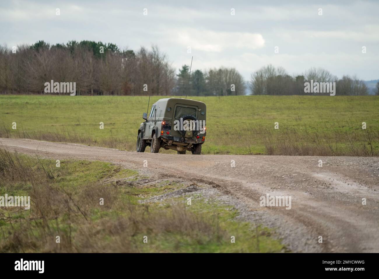 British army land rover defender wolf driving along a dirt track Stock ...