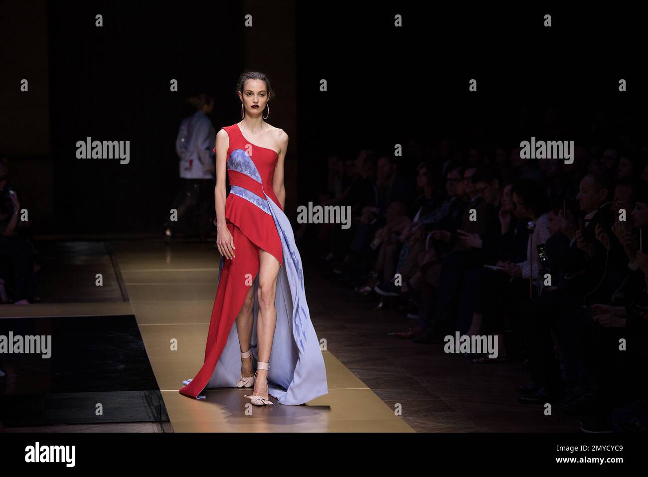 A model wears a creation as part of Versace's fall-winter 2016-2017 ...