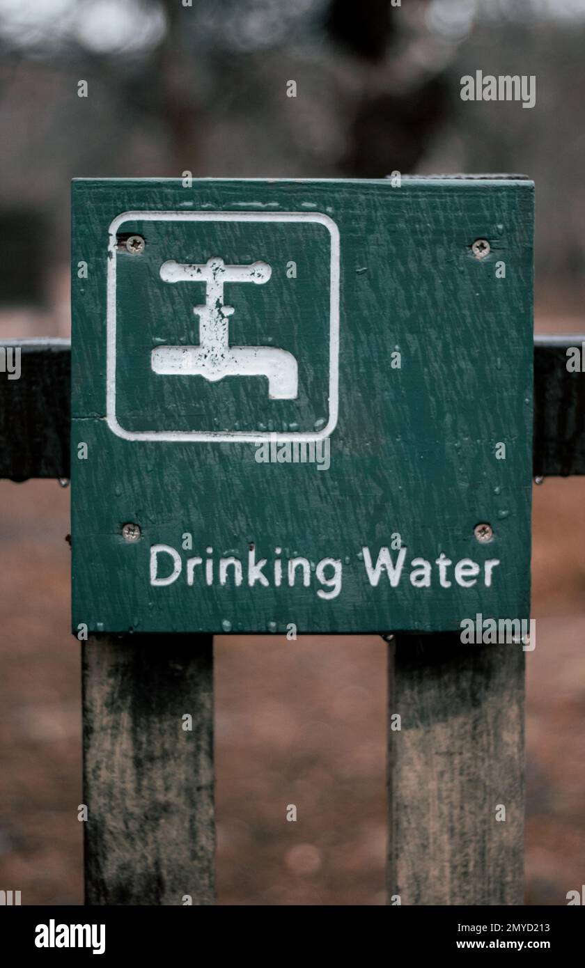A vertical shot of a wooden drinking water sign Stock Photo - Alamy