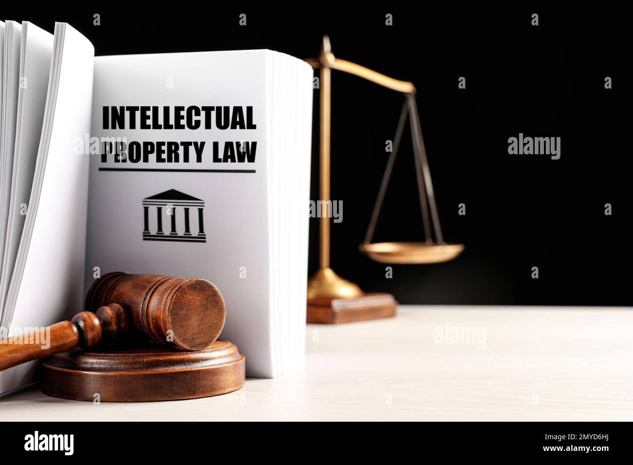 Intellectual Property law book, judge's gavel and scales of justice on ...
