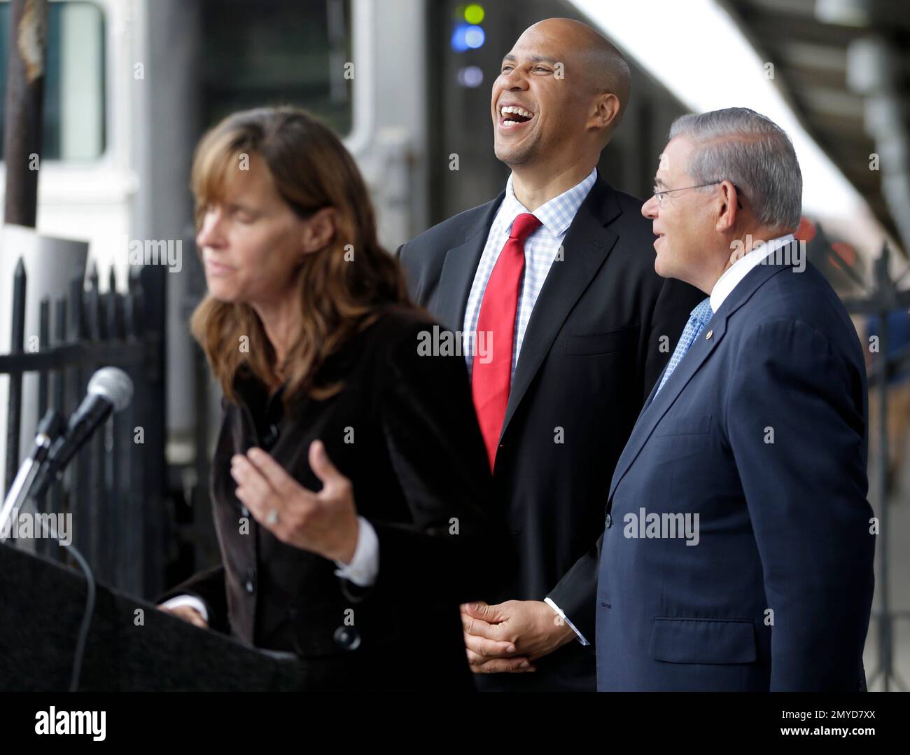 U.S. Sen. Cory Booker, center, reacts while talking to U.S. Sen. Bob ...