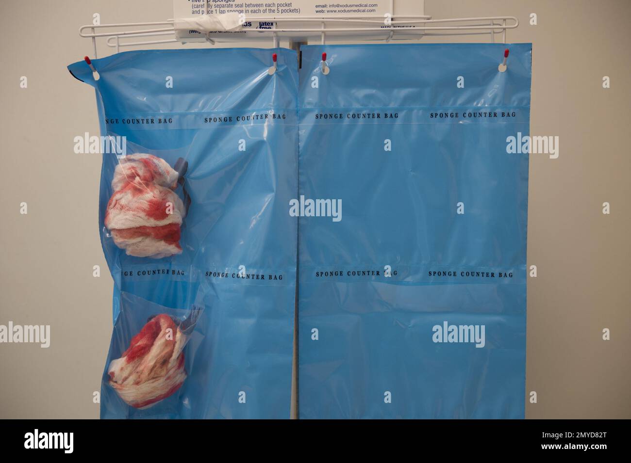 Sponge counter bag hangs inside an operating room during a kidney ...