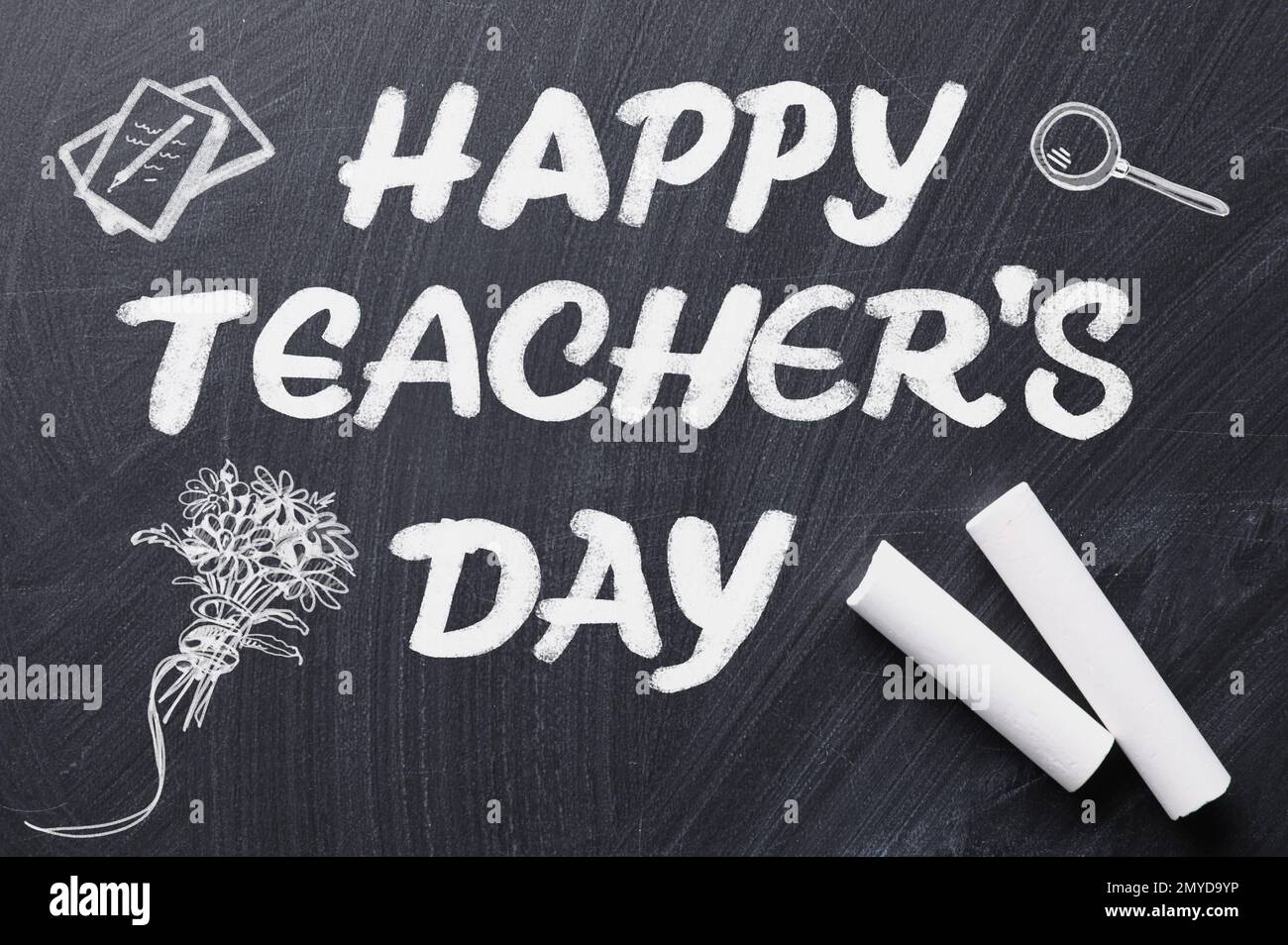 Text Happy Teacher's Day with drawings and chalk on blackboard, top ...