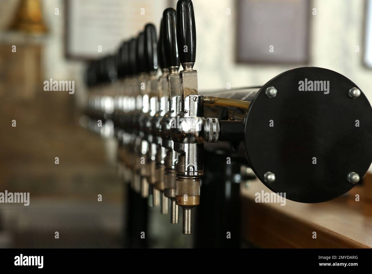 New modern beer taps in pub, closeup. Professional bar equipment Stock ...