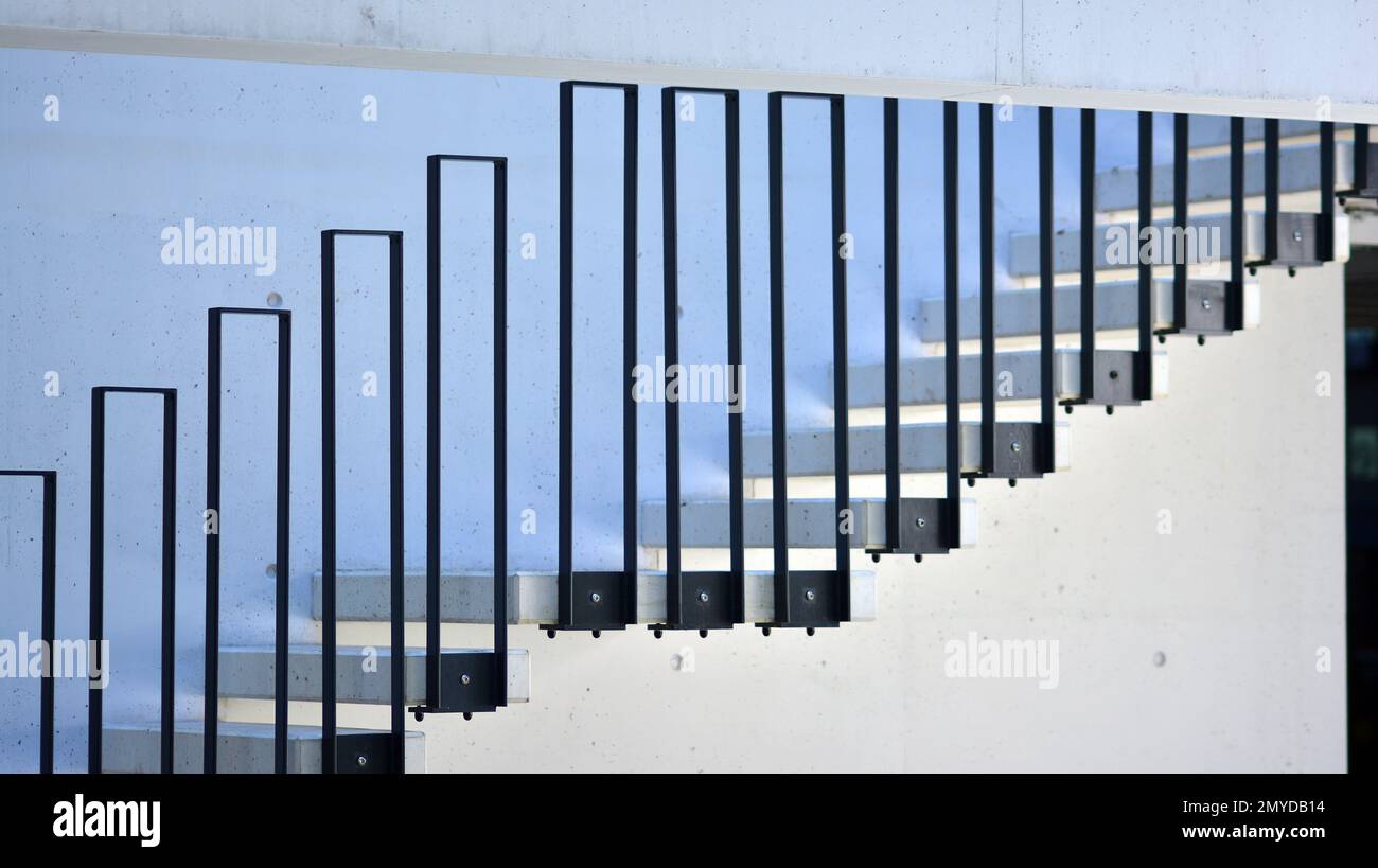 Modern concrete stairs and metal railings outside Stock Photo - Alamy