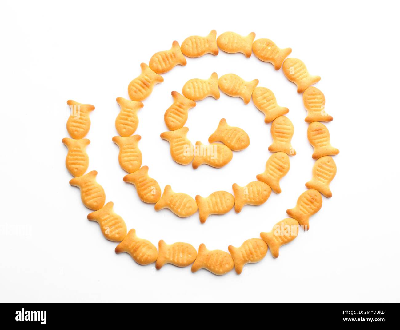 Delicious crispy goldfish crackers on white background, top view Stock ...