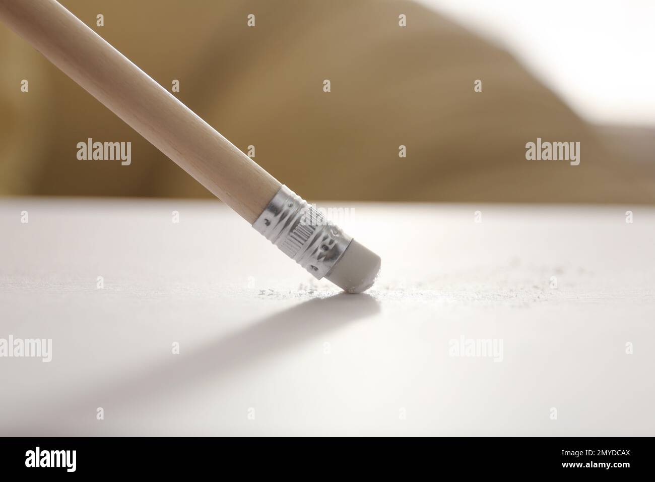 Correcting picture on paper with pencil eraser, closeup view Stock ...