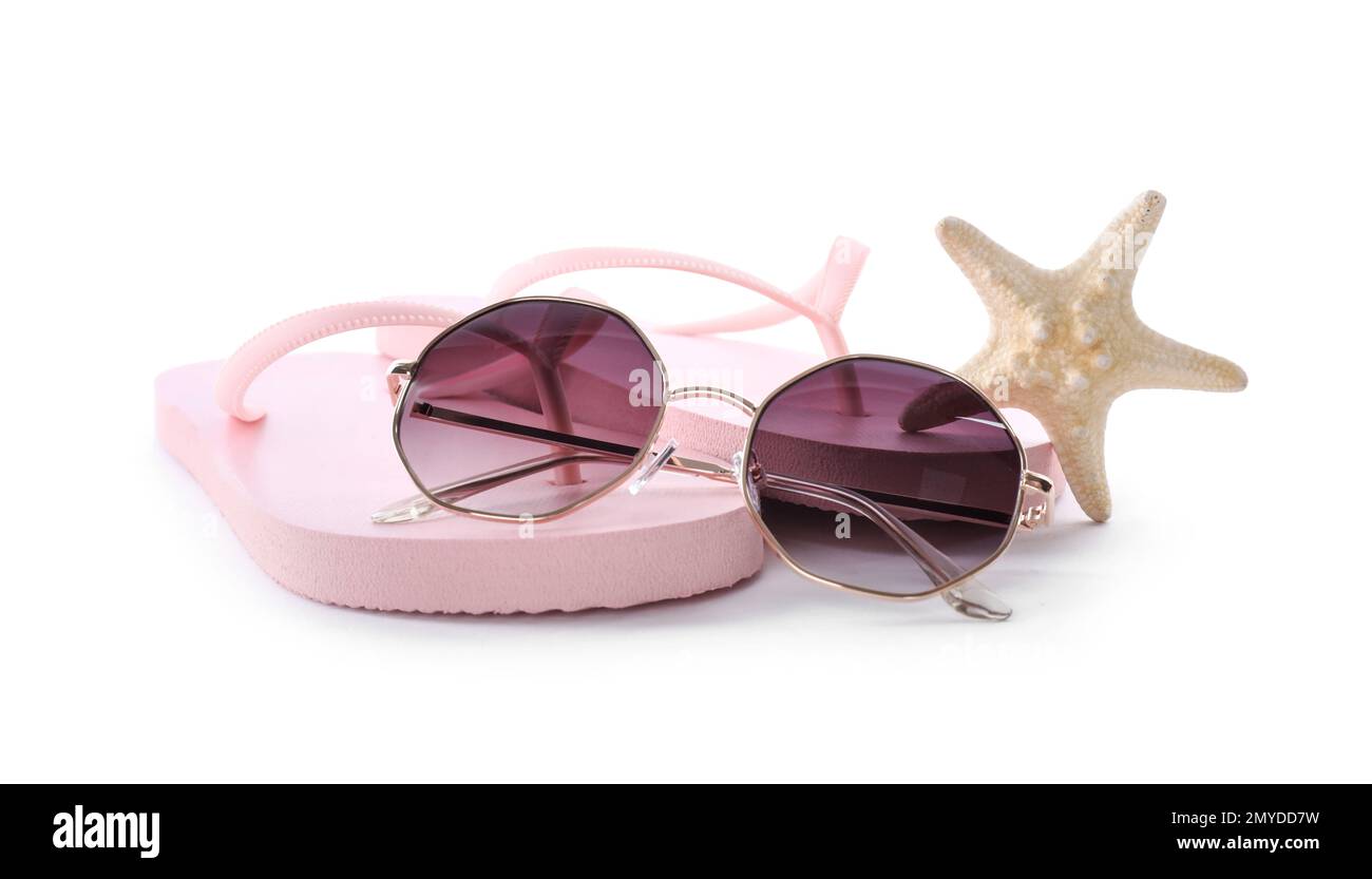 Flip flops, sunglasses and starfish on white background. Beach objects ...