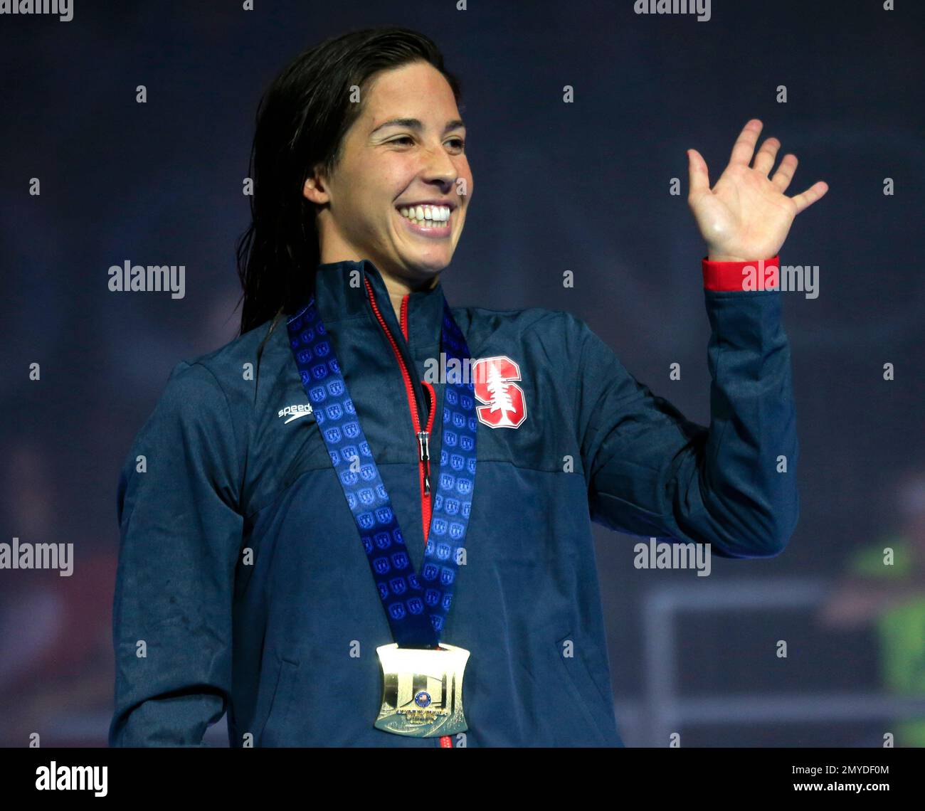Maya DiRado waves after receiving her gold medal for the women's 200 ...