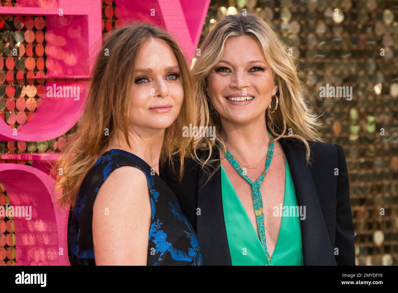 Fashion designer Stella McCartney, left, and model Kate Moss pose for ...