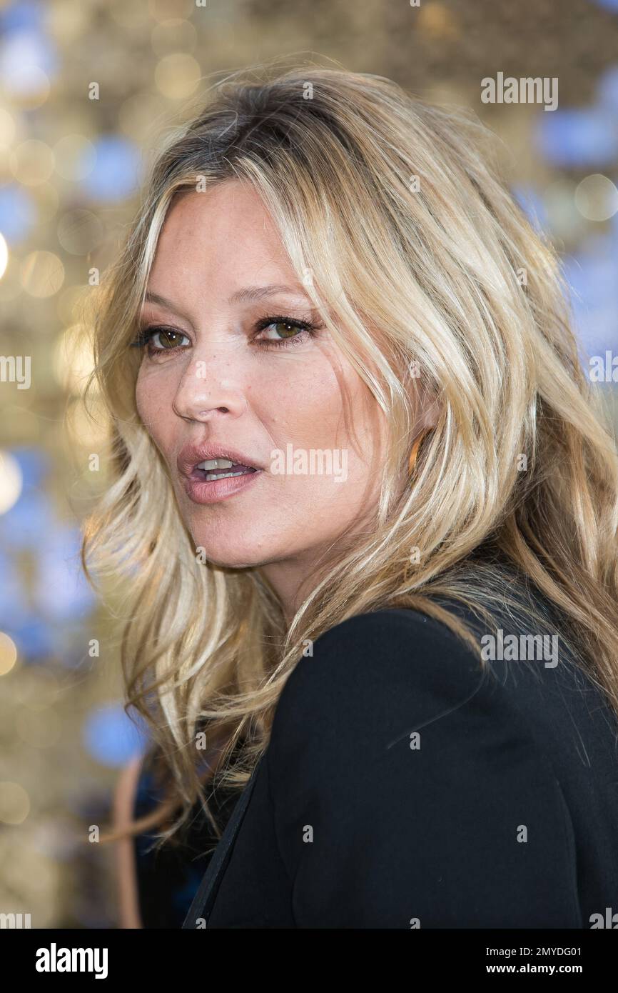 Fashion model Kate Moss poses for photographers upon arrival at the ...
