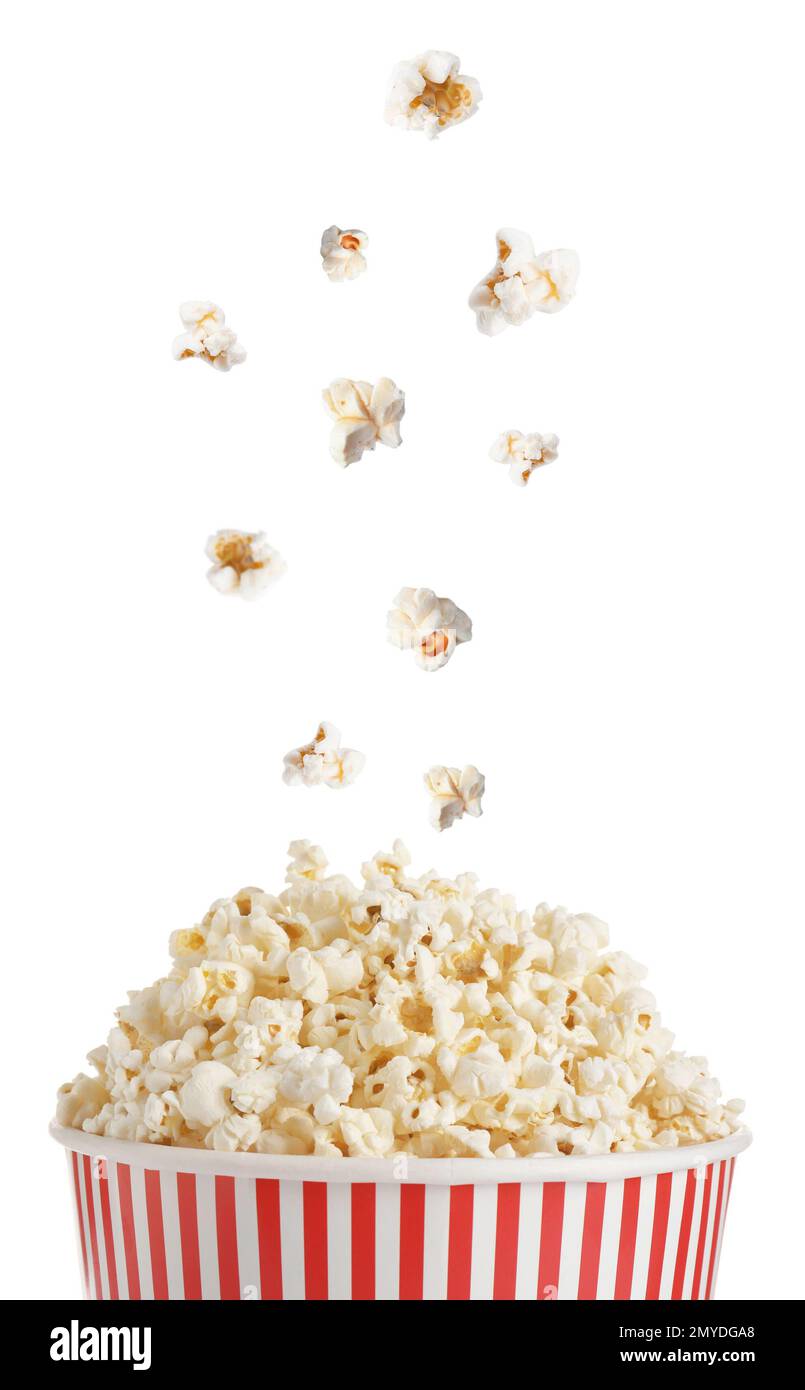 Hot popcorn falling into paper bucket on white background Stock Photo ...