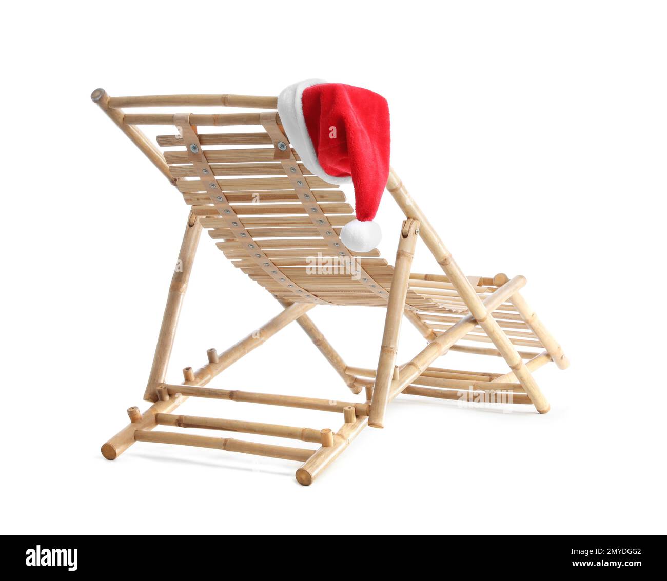 Wooden deck chair and Santa Claus hat on white background. Christmas ...