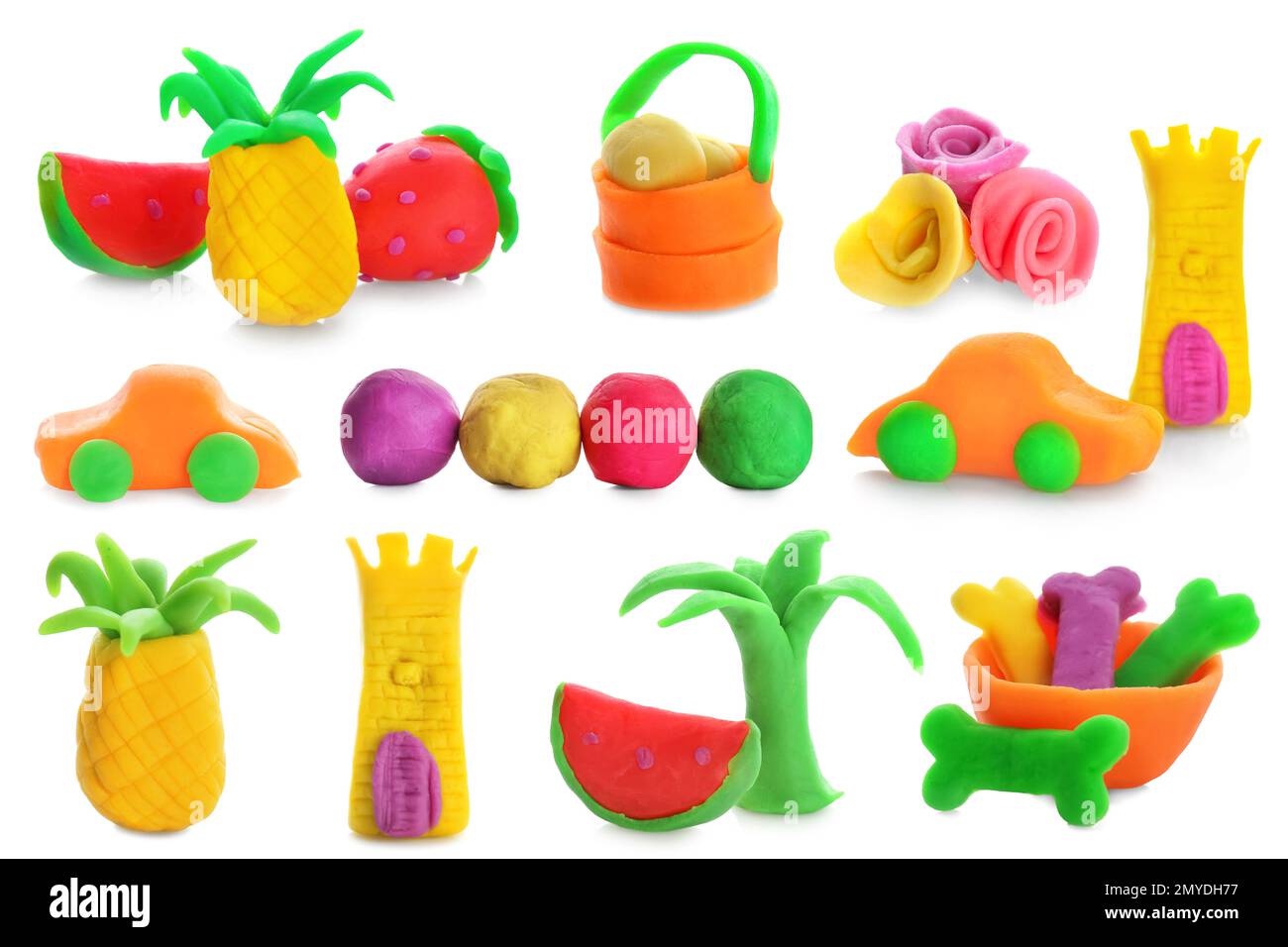 Collection of small figures made from play dough on white background ...