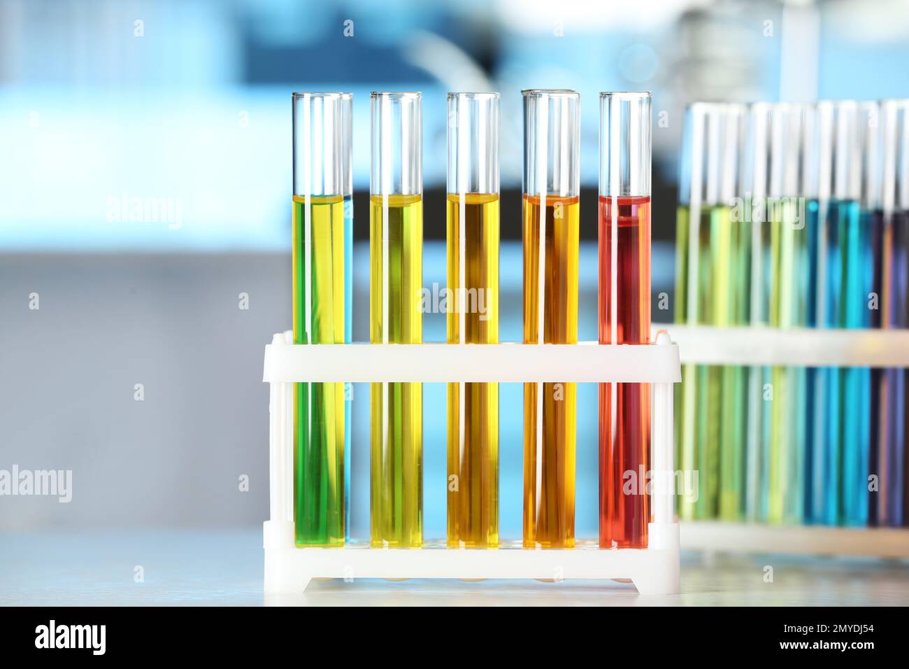 Test tubes with liquid samples on table. Laboratory analysis Stock ...