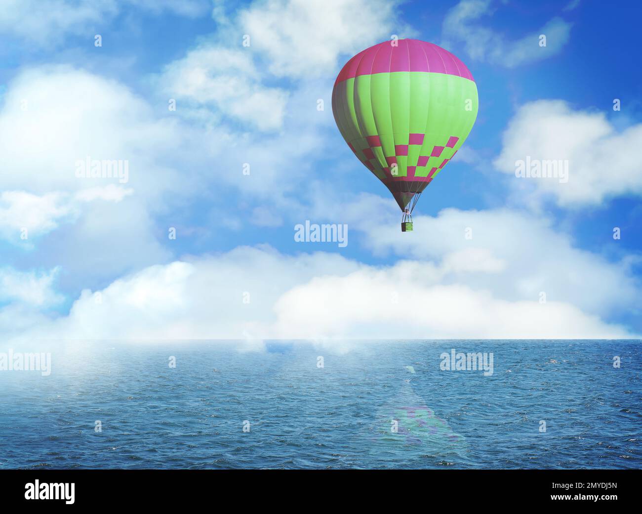 Dream world. Hot air balloon in blue sky with clouds over sea Stock ...