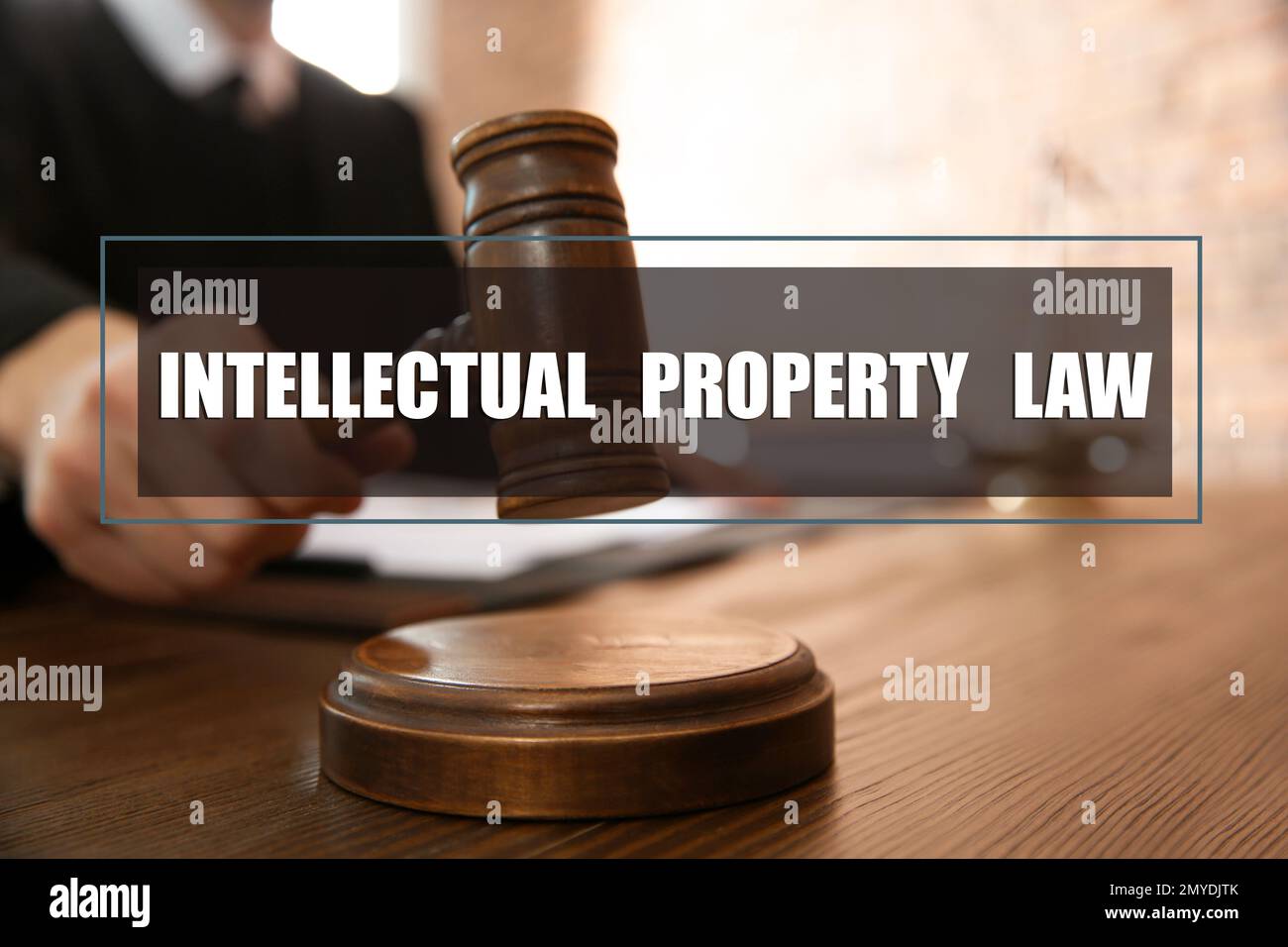 Intellectual property law. Judge with gavel at table, closeup Stock ...