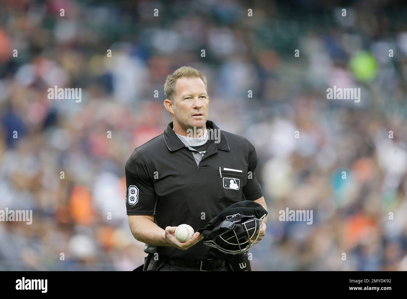 Homeplate umpire Jim Wolf is seen during the first inning of a baseball ...
